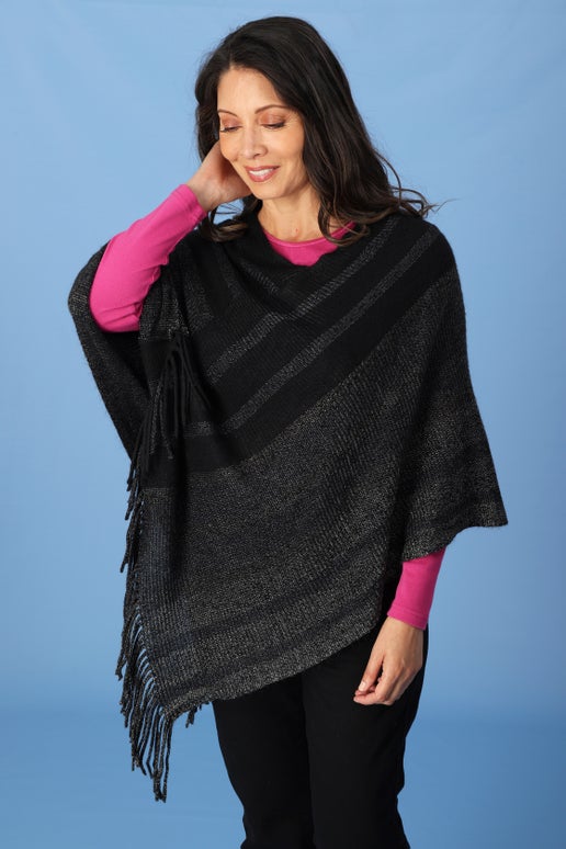 Knit Layer Poncho With Angled Tassels in Black | Caroline Eve